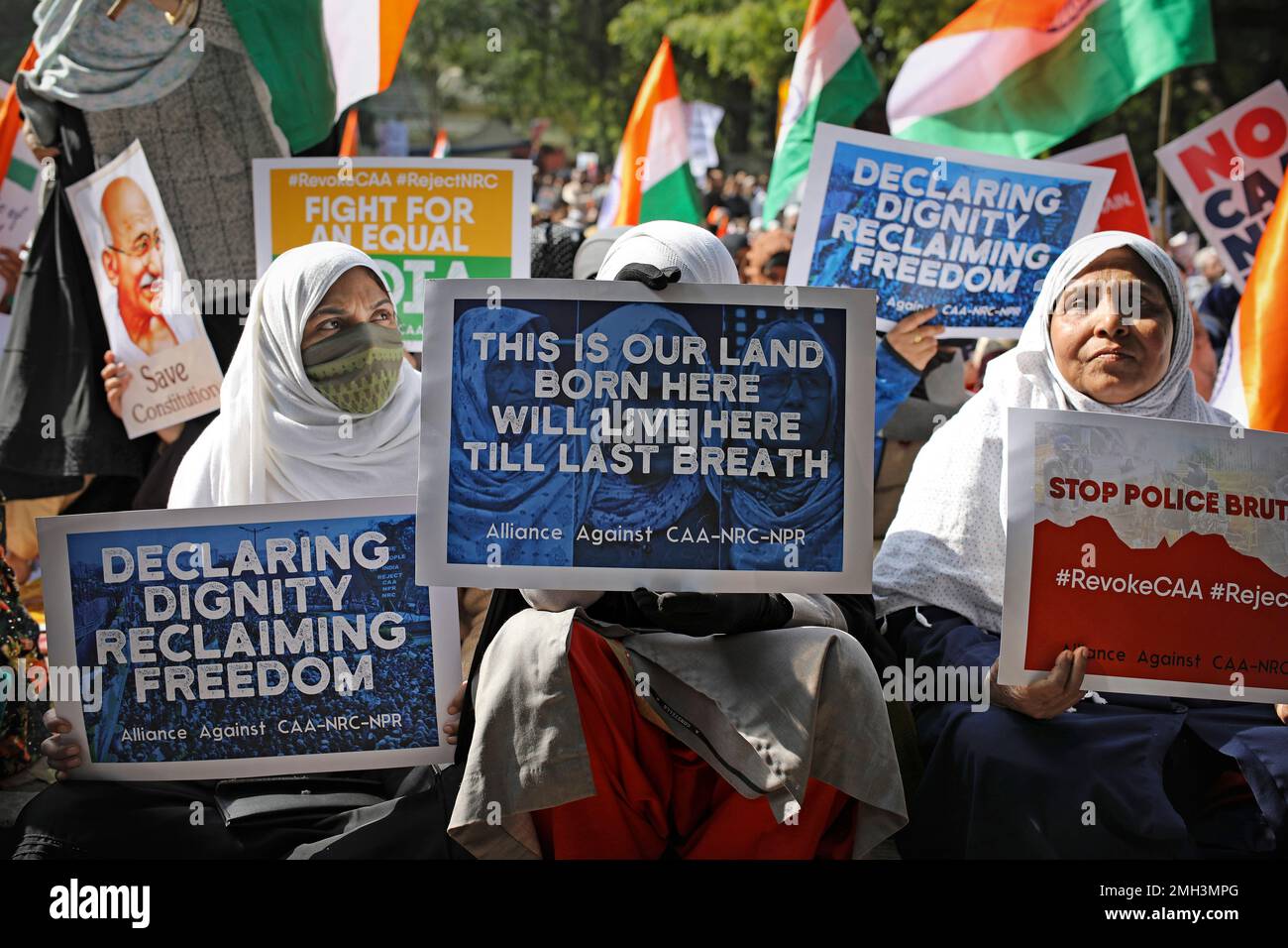 Indian Muslim women hold placards as they participate in a protest ...