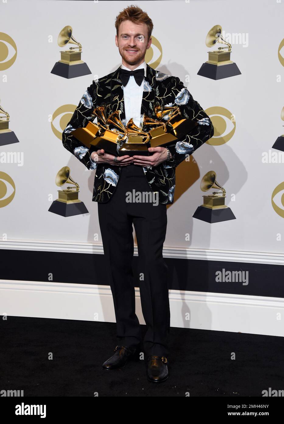 Finneas O'Connell poses in the press room with the awards for best song ...