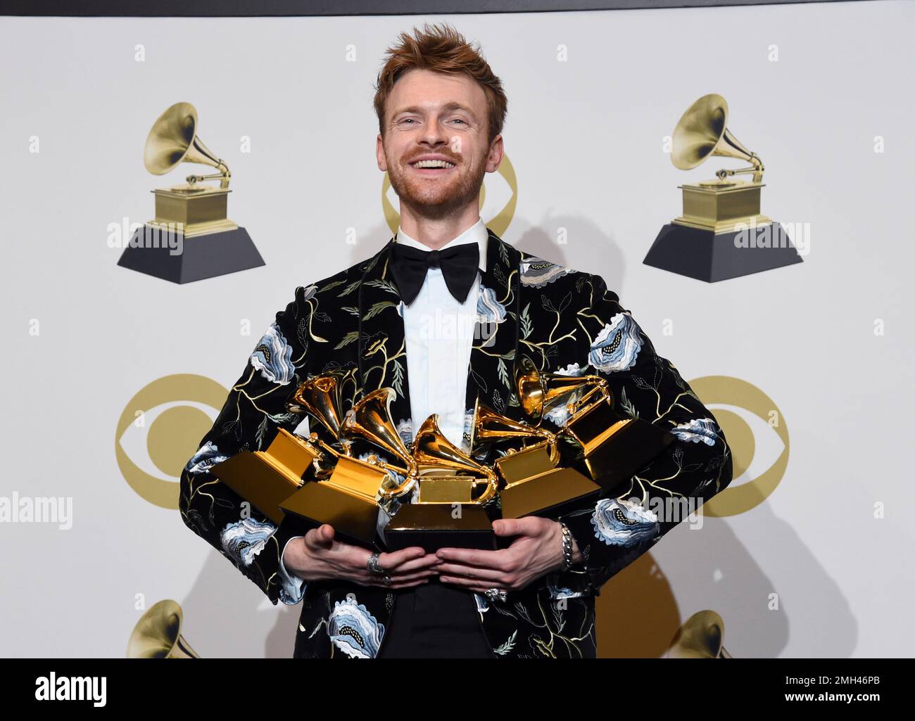 Finneas O'Connell poses in the press room with the awards for best song ...