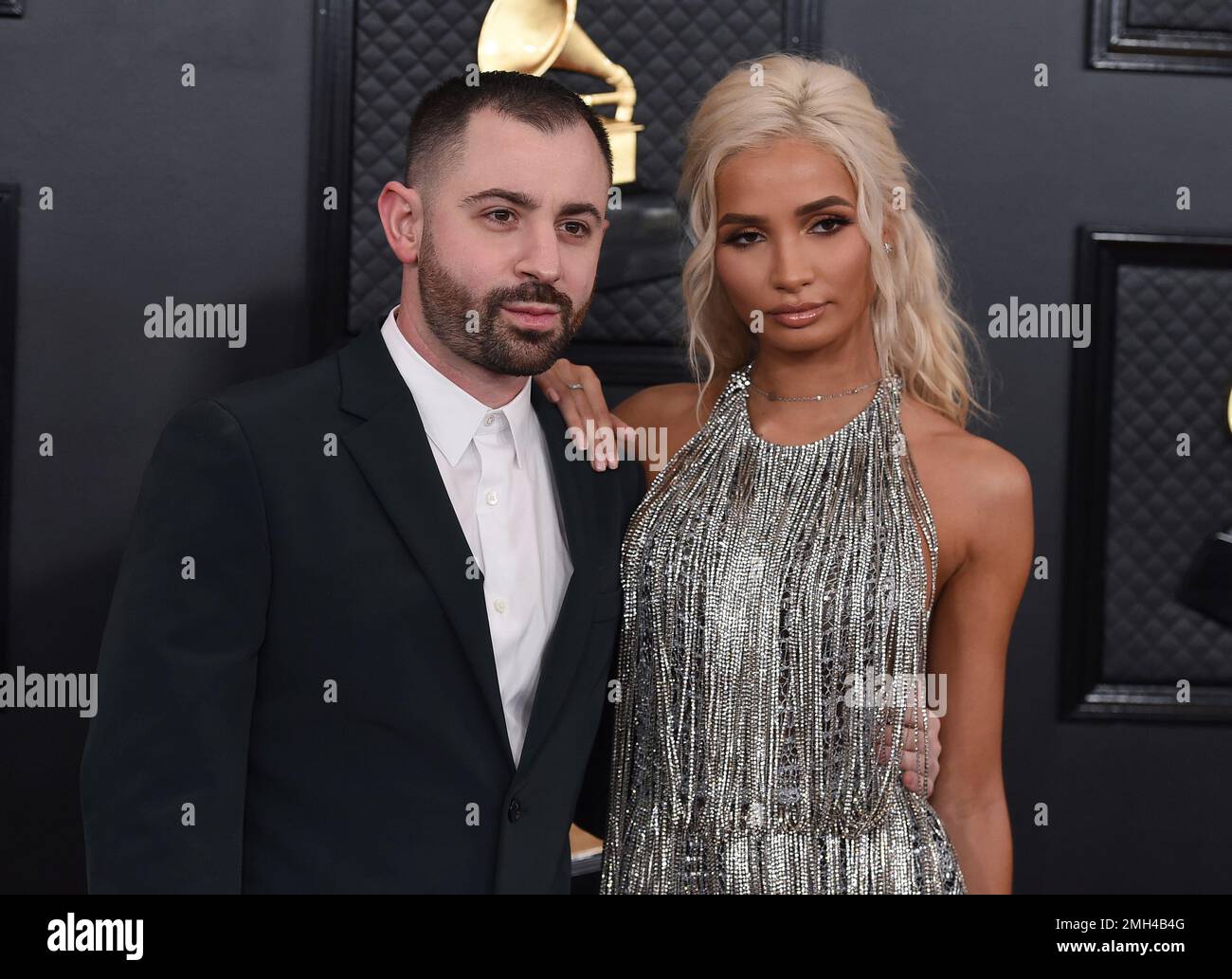 Louis Bell, left, and Pia Mia arrive at the 62nd annual Grammy Awards ...