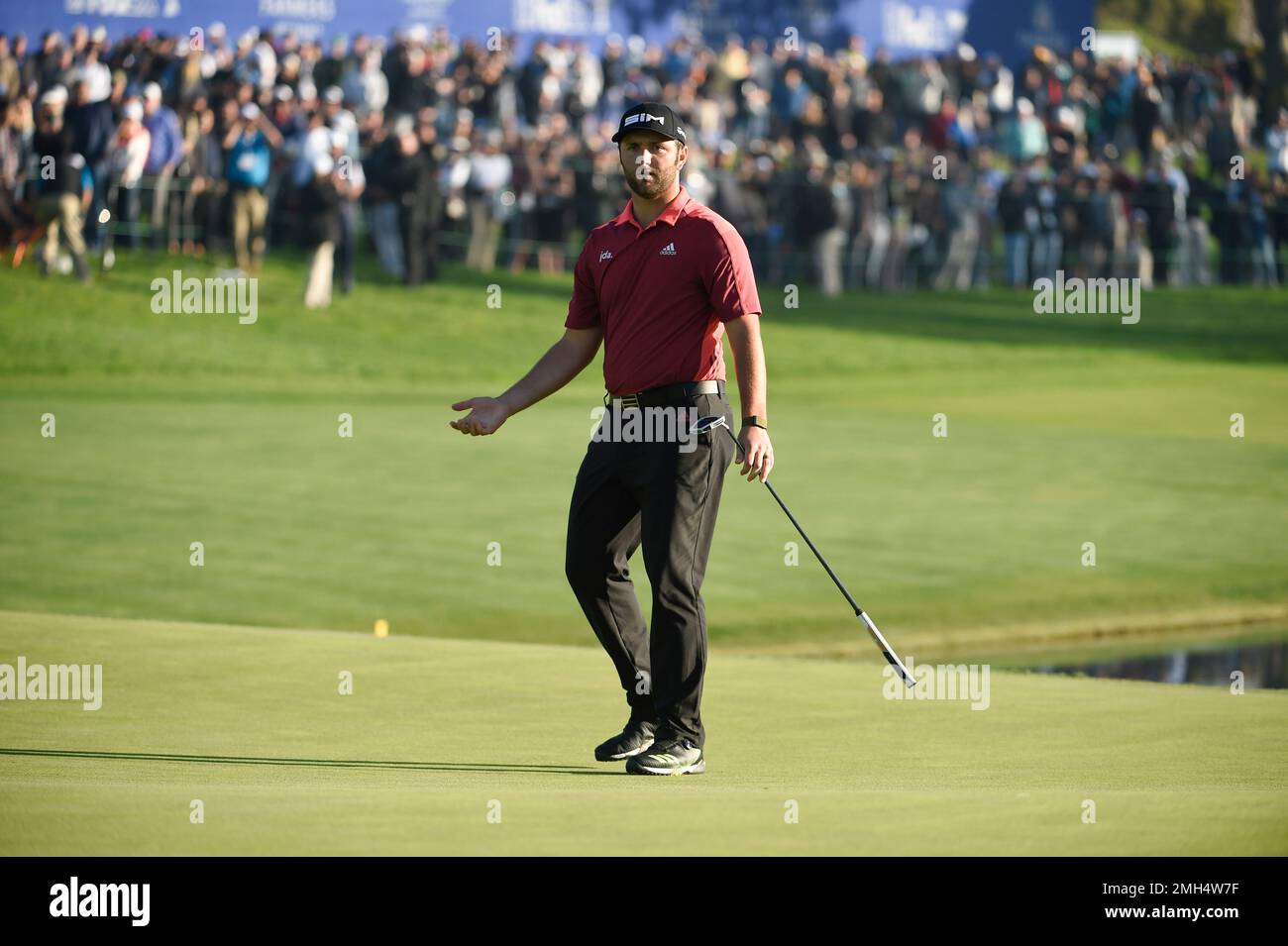 Jon Rahm of Spain reacts after missing a putt on the 18th hole of the ...