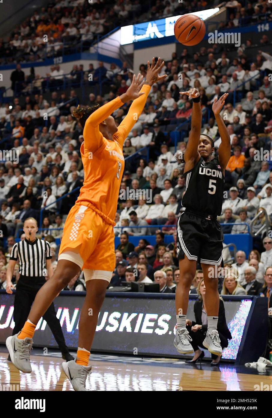 Connecticut's Crystal Dangerfield shoots over Tennessee's Jazmine ...