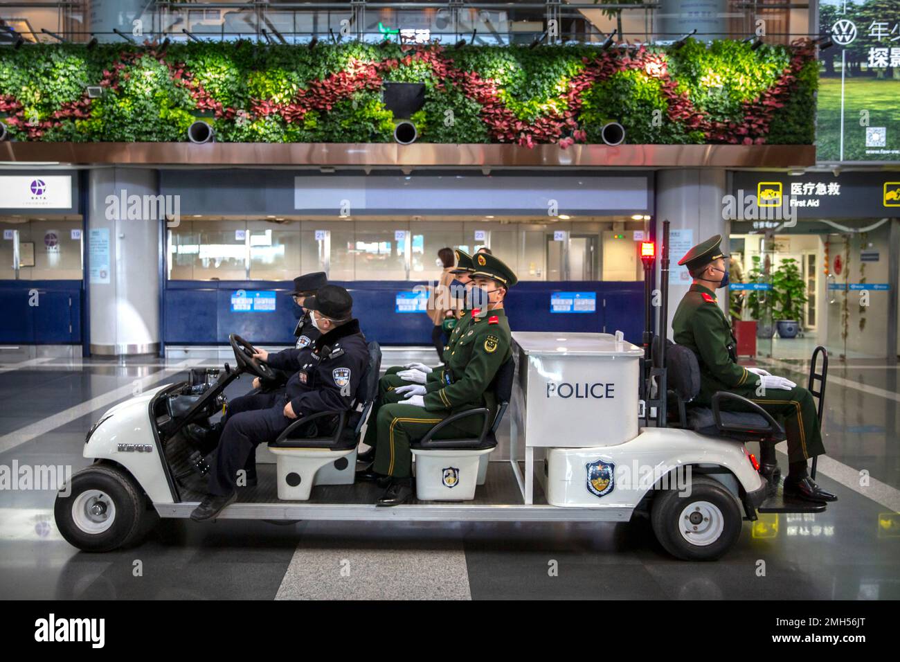 Chinese paramilitary police and security officers wear face masks as ...