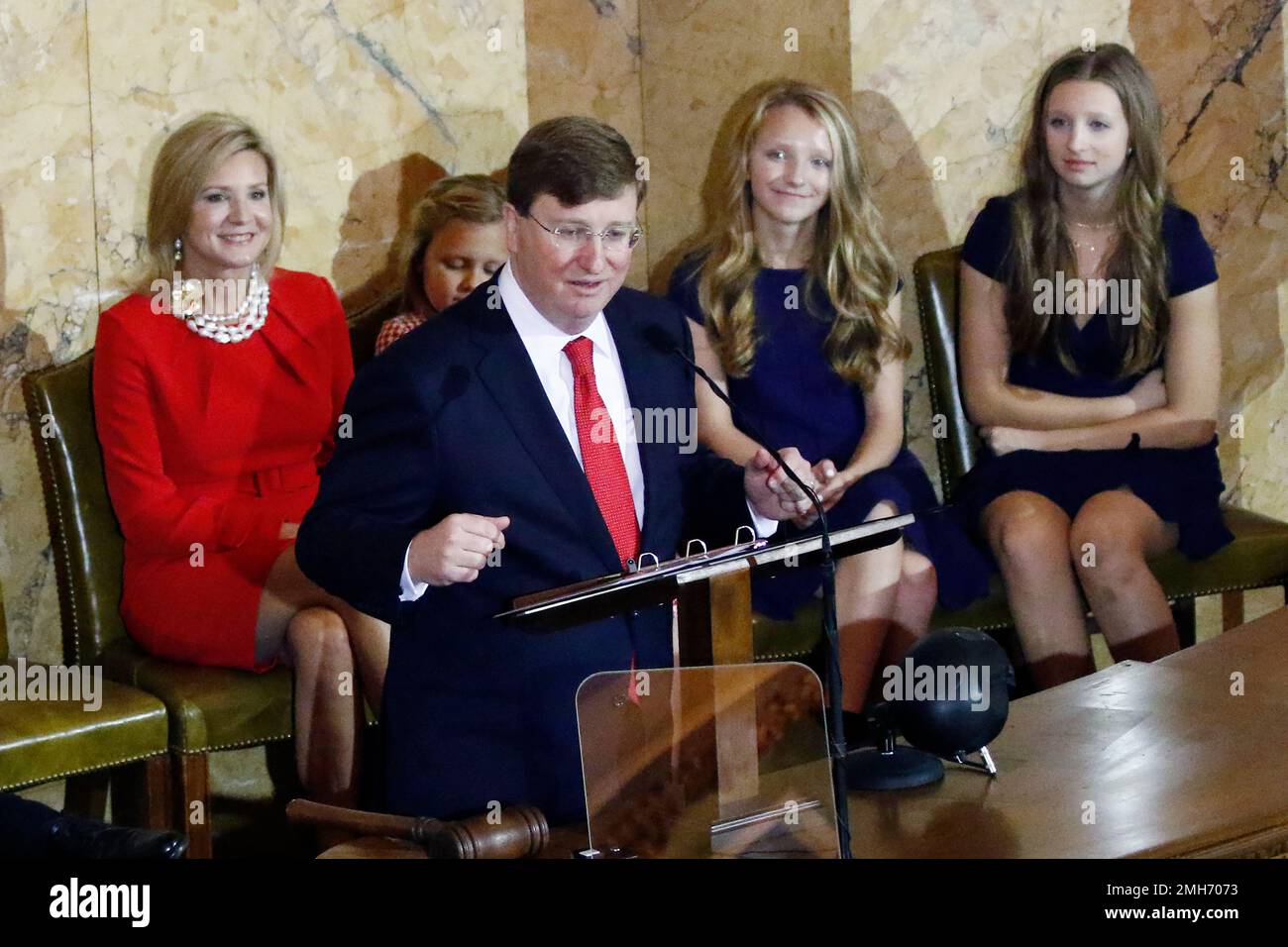Mississippi Gov. Tate Reeves, center, delivers his address after being ...