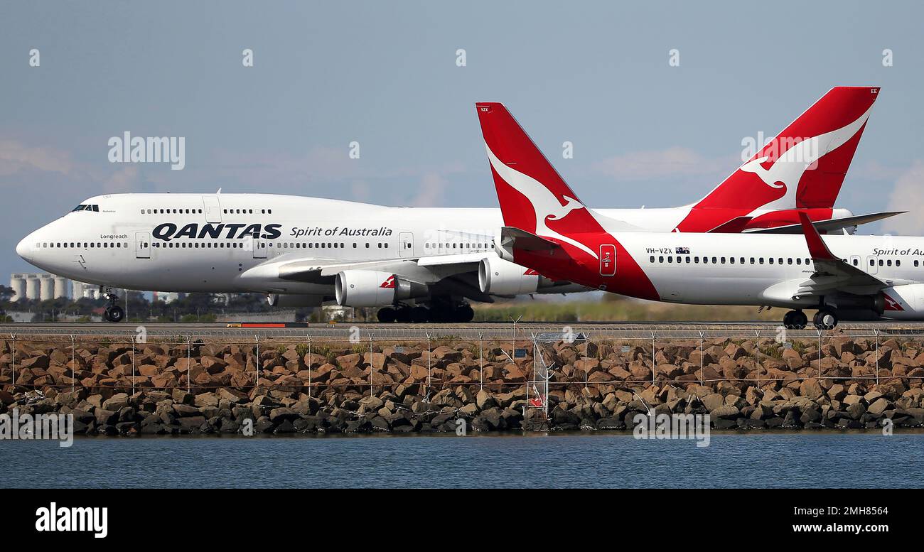 FILE - In this Aug. 20, 2015 file photo, two Qantas planes taxi on the runway at Sydney Airport ...