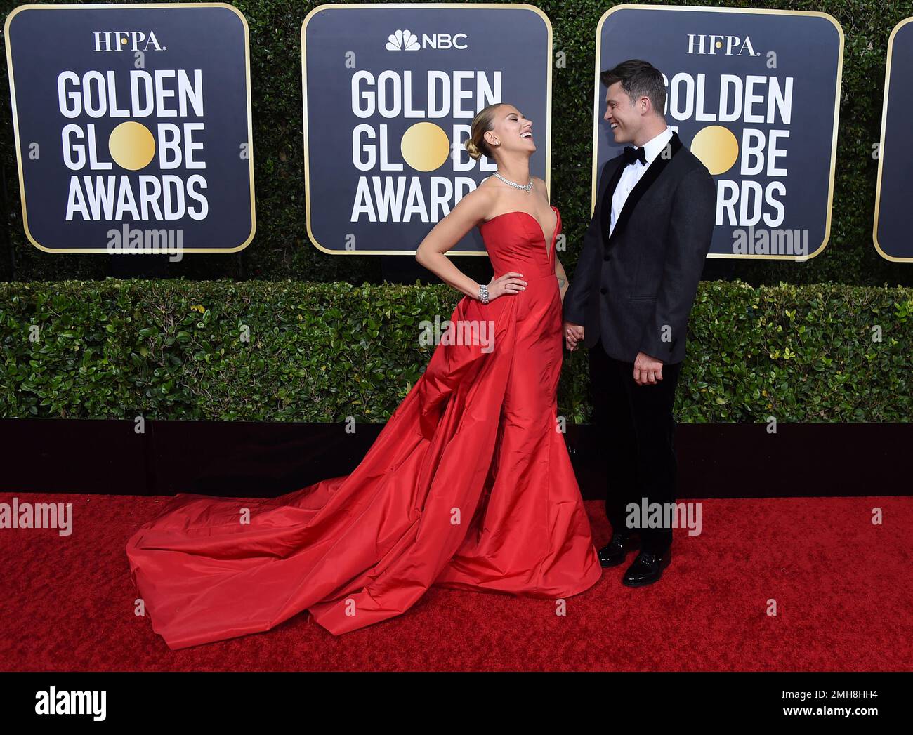 Scarlett Johansson, left, and Colin Jost arrive at the 77th annual ...