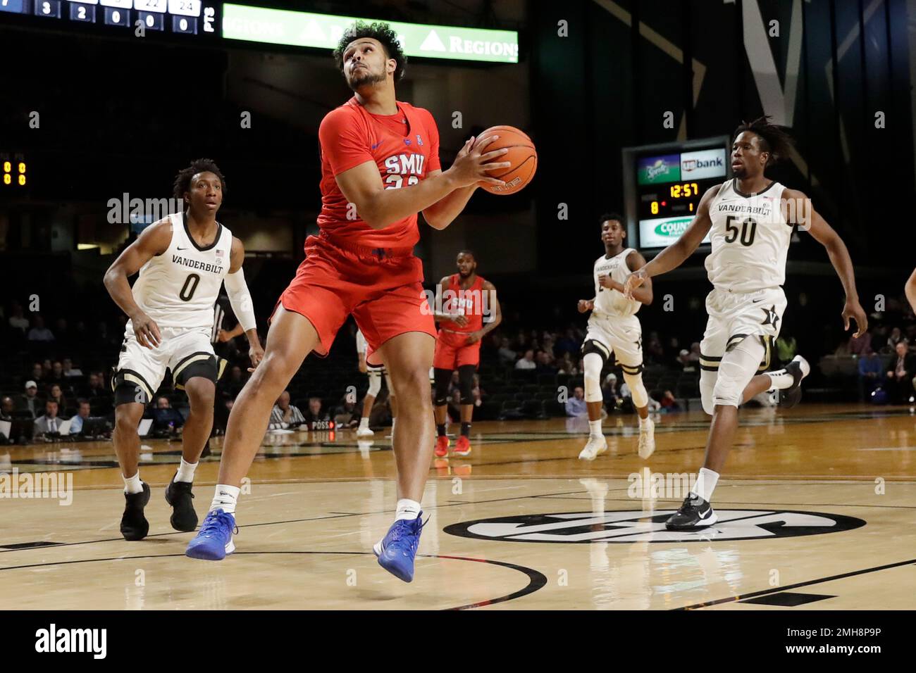 SMU forward Isiah Jasey (22) scores ahead of Vanderbilt guard Saben Lee ...