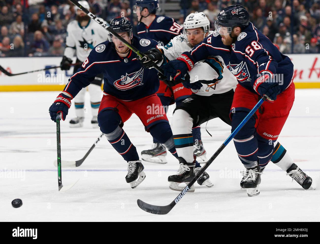 Columbus Blue Jackets' Pierre-Luc Dubois, left, David Savard, right ...
