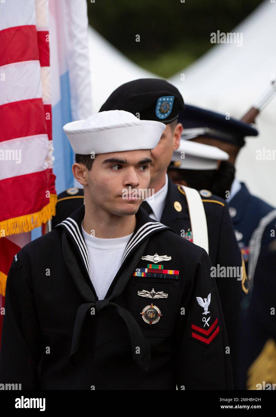 A U.S. Navy sailor participates in a ceremony to commemorate the 75th ...
