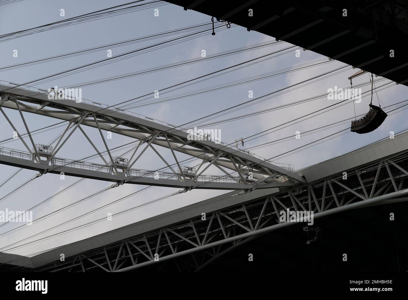 Workers work at the catwalk of the Al Janoub Stadium, one of the 2022 ...