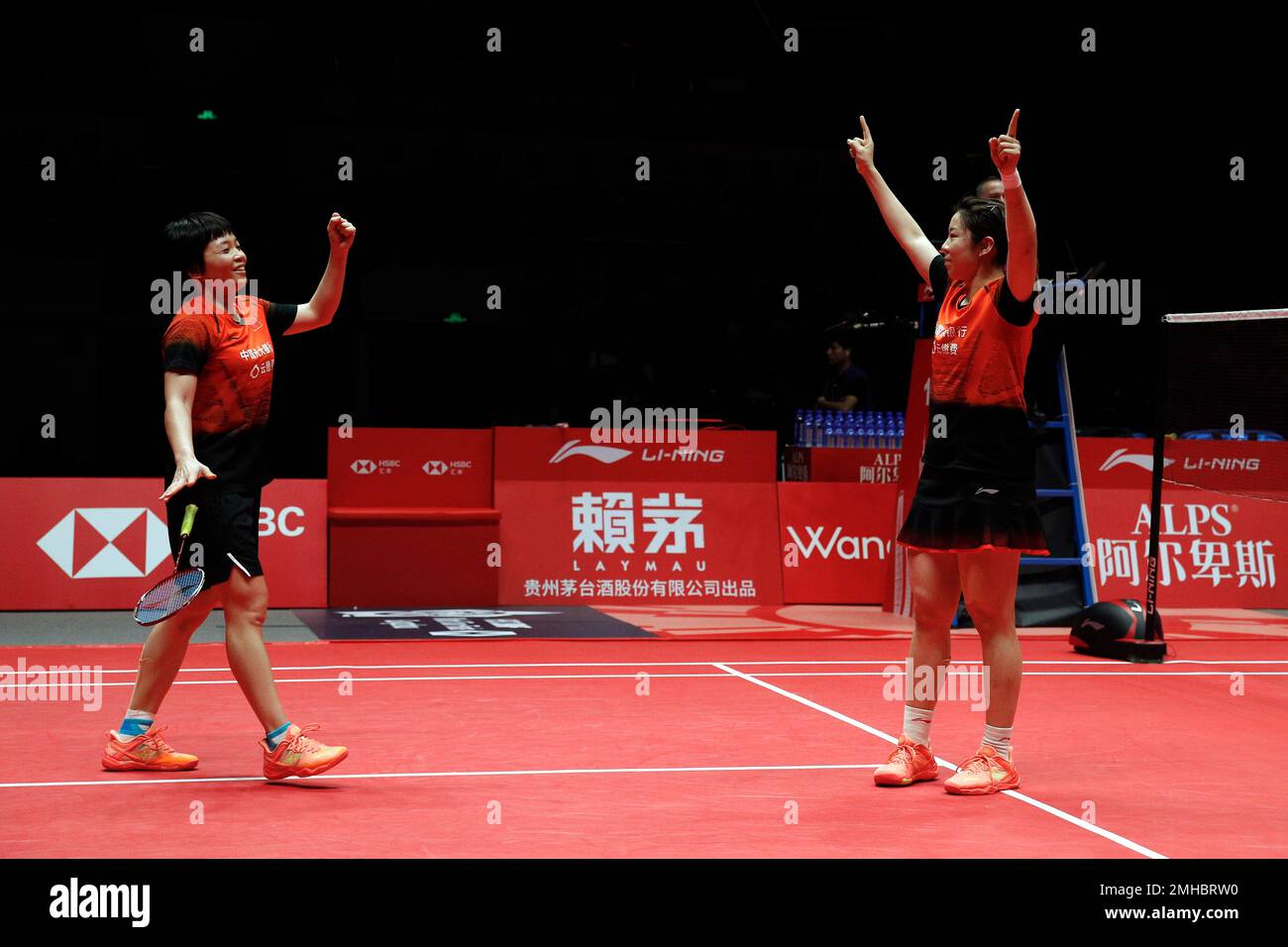 China's Chen Qing Chen, left, and her teammate Jia Yi celebrate after ...