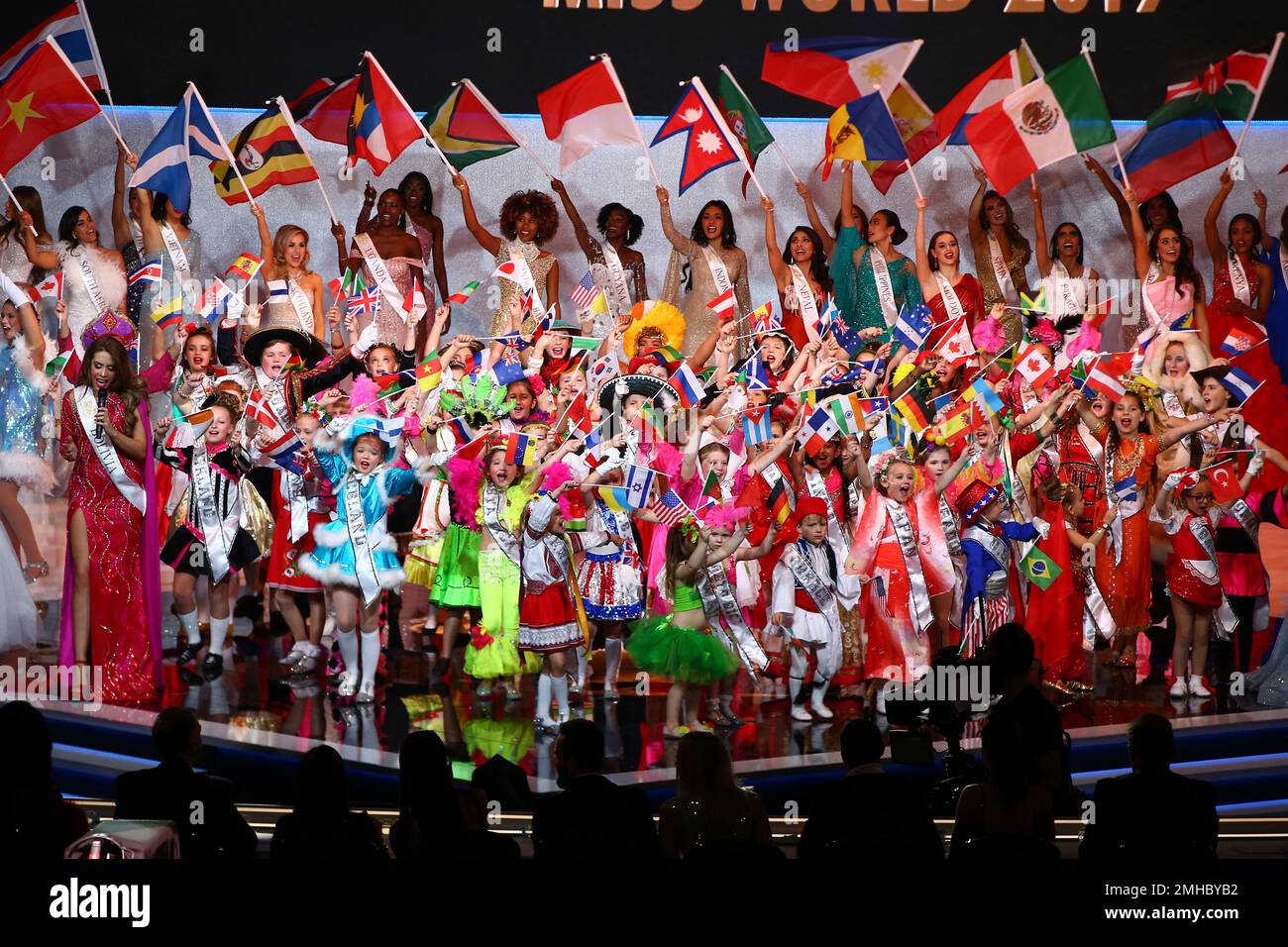 Dozens of children representing the many countries competing are ...