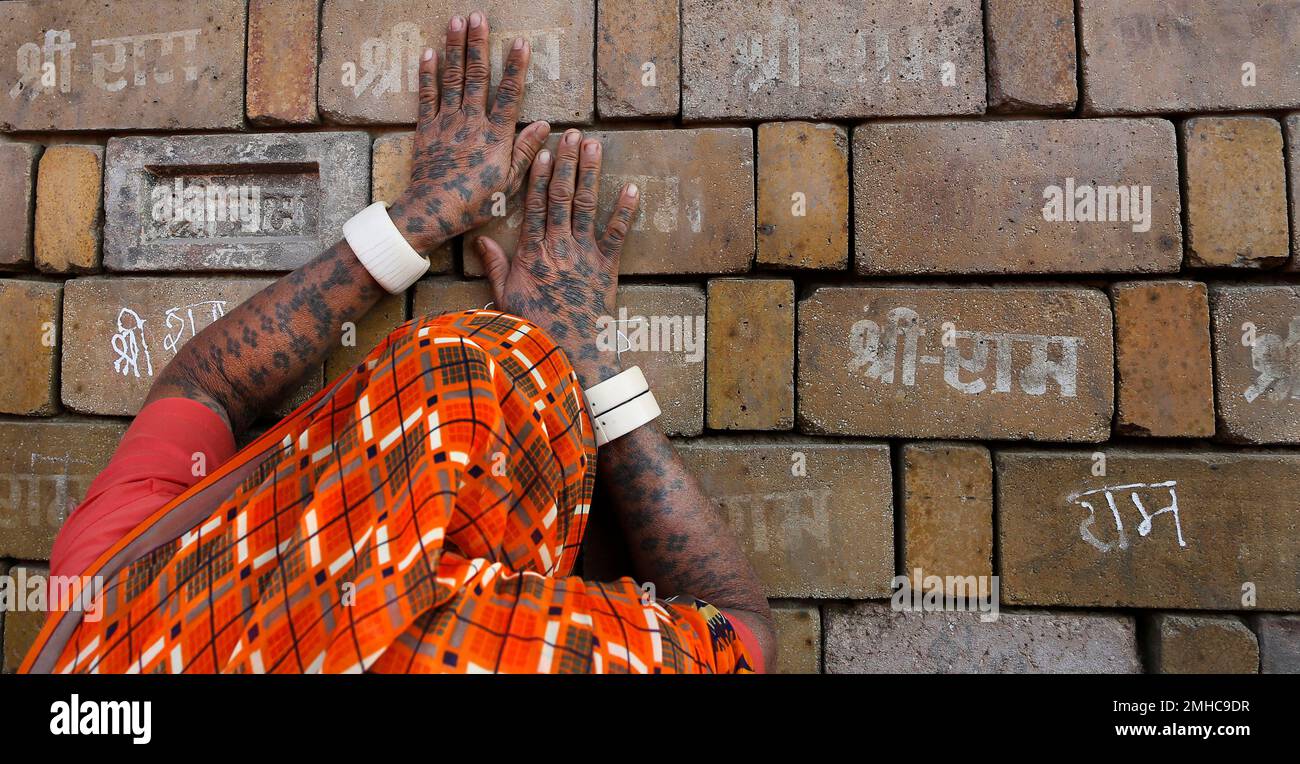 FILE- In this Nov. 11, 2019 file photo, a Hindu woman devotee prays to ...