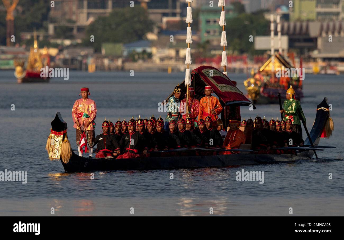 Oarsman paddle a barge during the Royal Barge Procession on the Chao ...