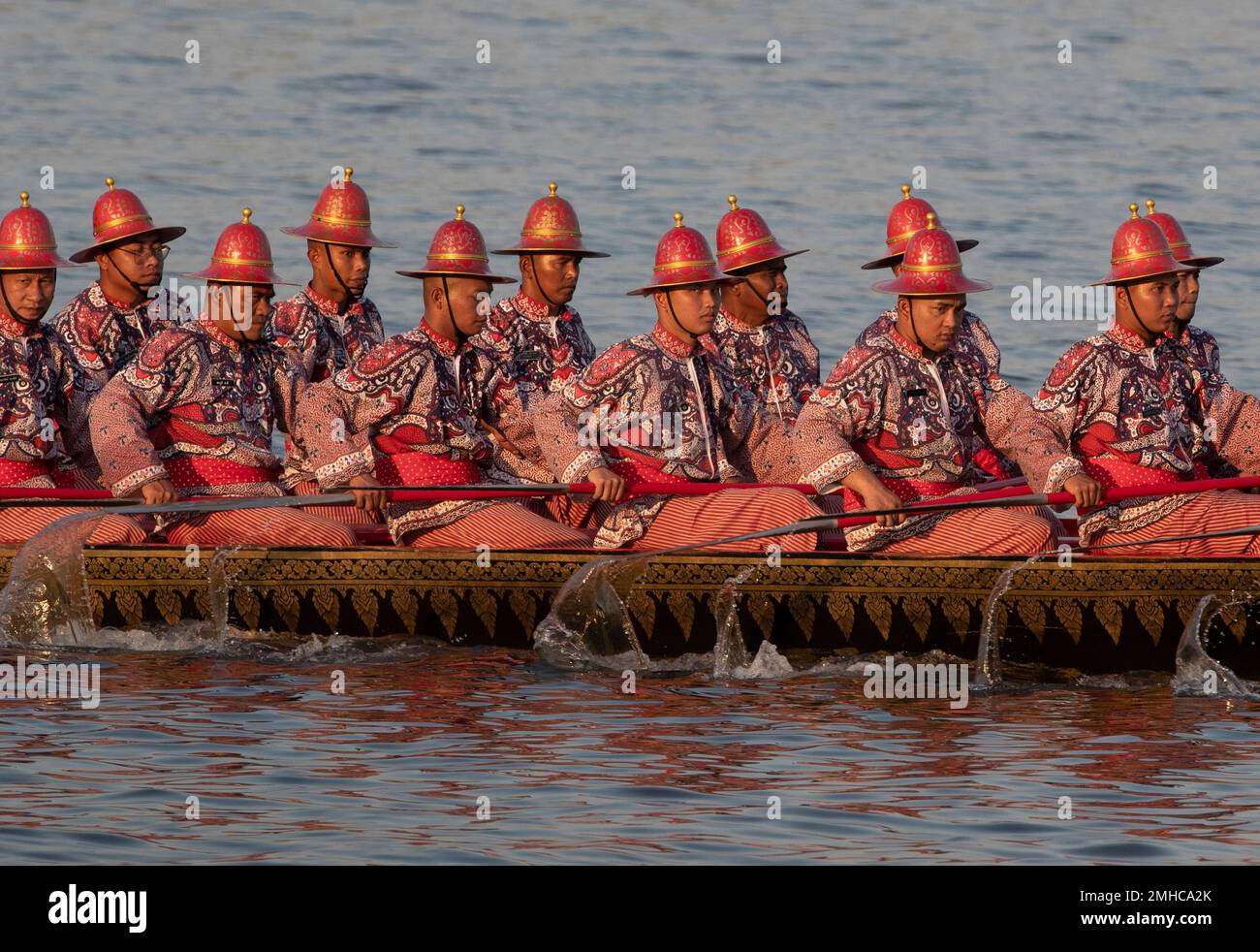 Oarsmen paddle one of the royal barges during the Royal Barge ...