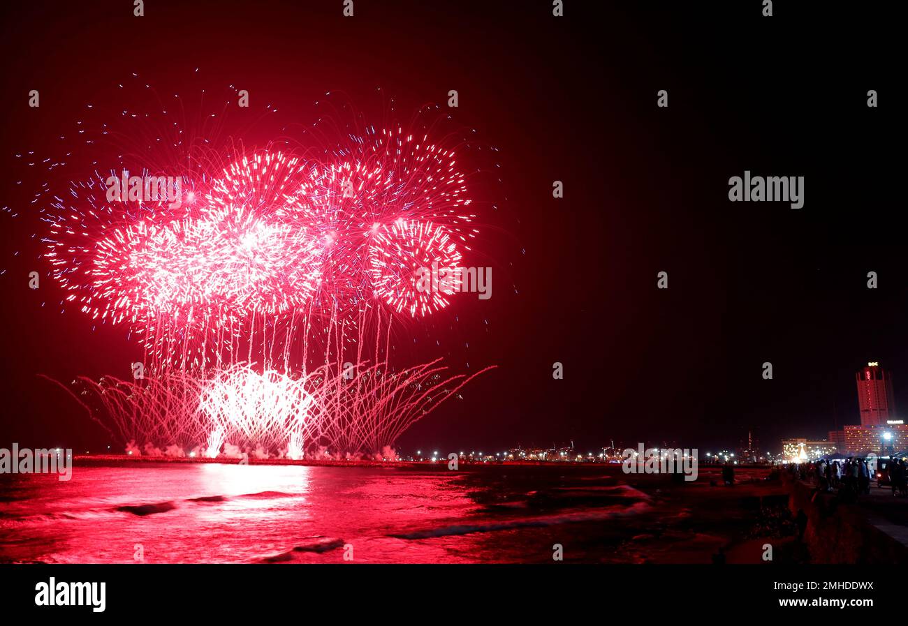 Pyrotechnics go off from the reclaimed land from the Indian Ocean for ...