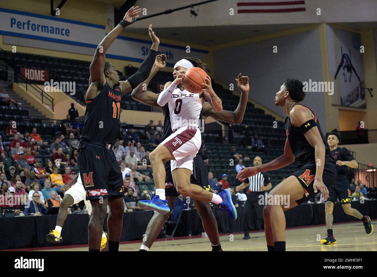 Temple guard Alani Moore II (0) goes up for a shot between Maryland ...