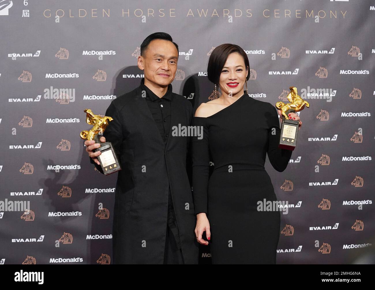 Malaysian actress Yeo Yann-yann, right, and Taiwanese actor Chen Yi-wen hold their awards for ...
