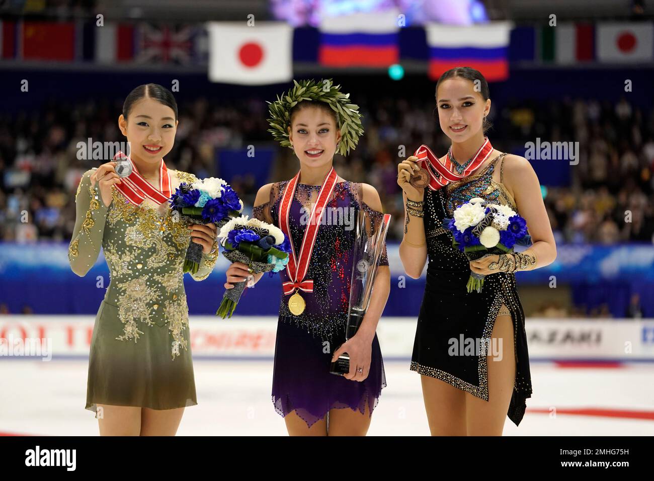 Gold medalist Alena Kostornaia of Russia, center, poses for ...