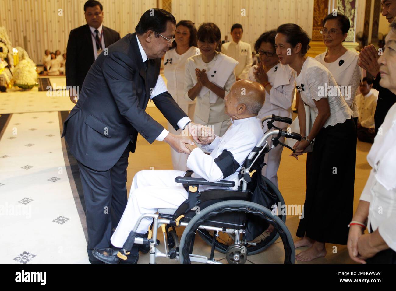Cambodian Prime Minister Hun Sen, left, greets Prince Norodom Ranariddh ...