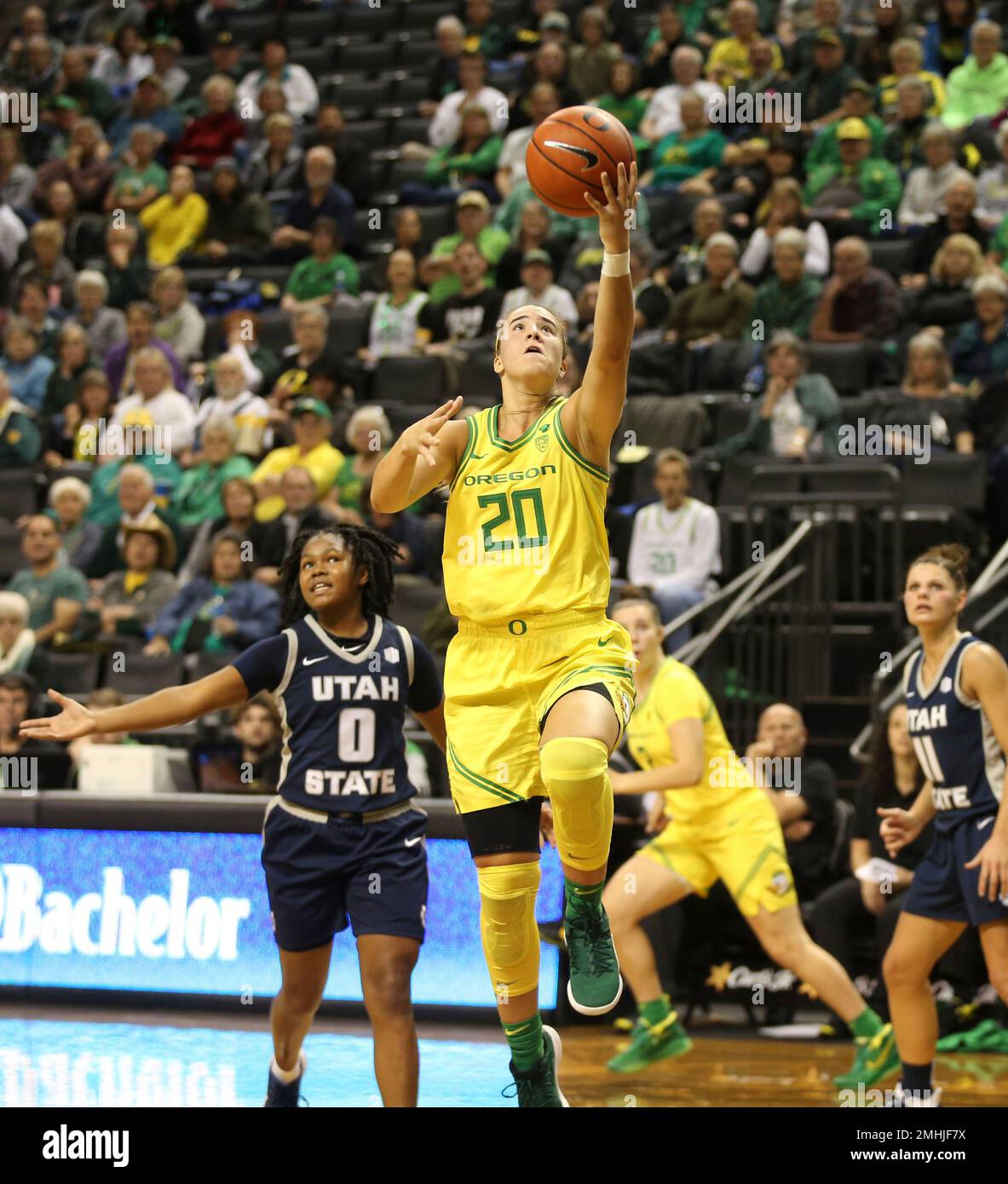 Oregon's Sabrina Ionescu, center, goes to the basket ahead of Utah ...