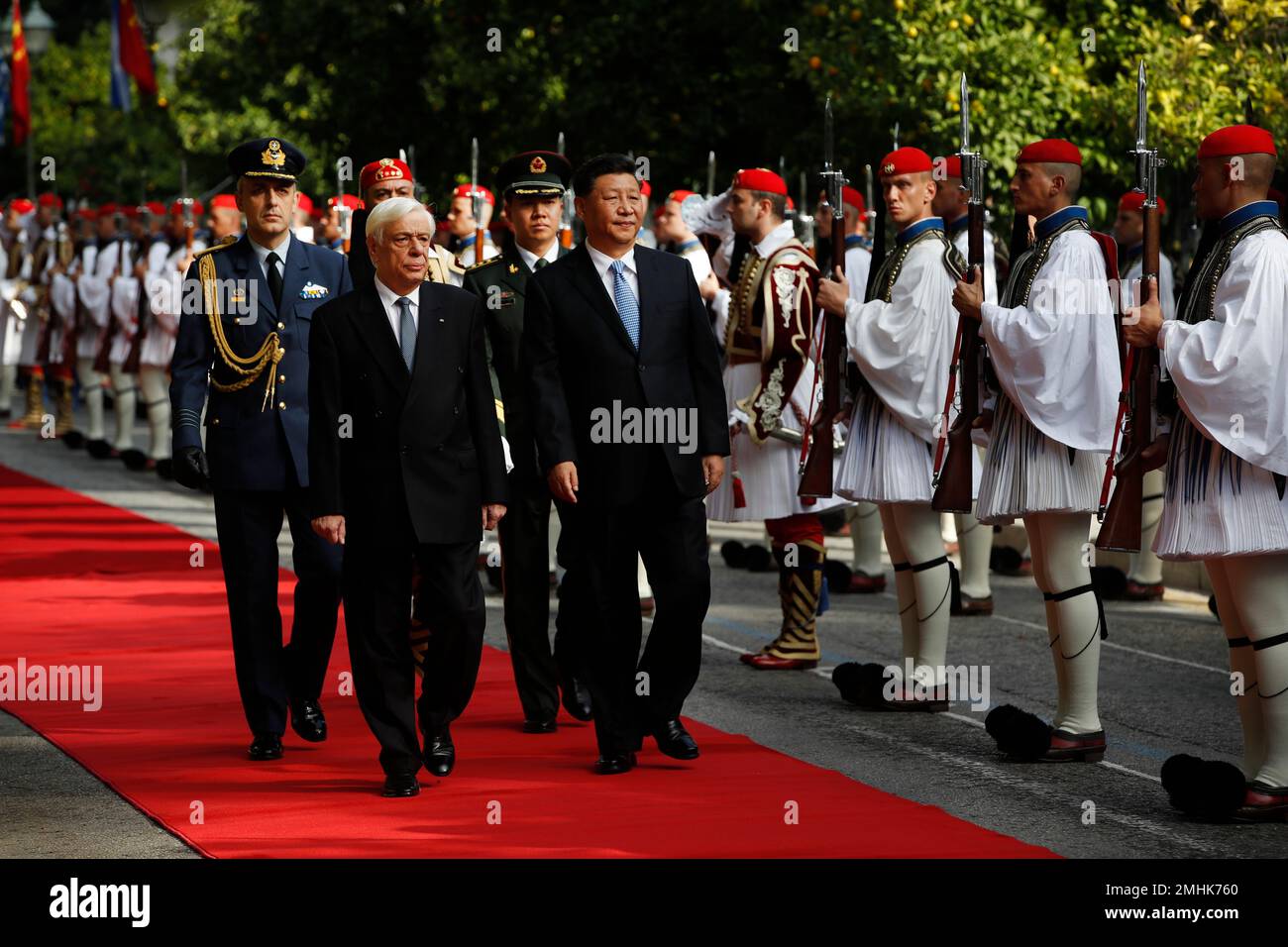 China's President Xi Jinping, centre and his Greek counterpart Prokopis Pavlopoulos, left ...