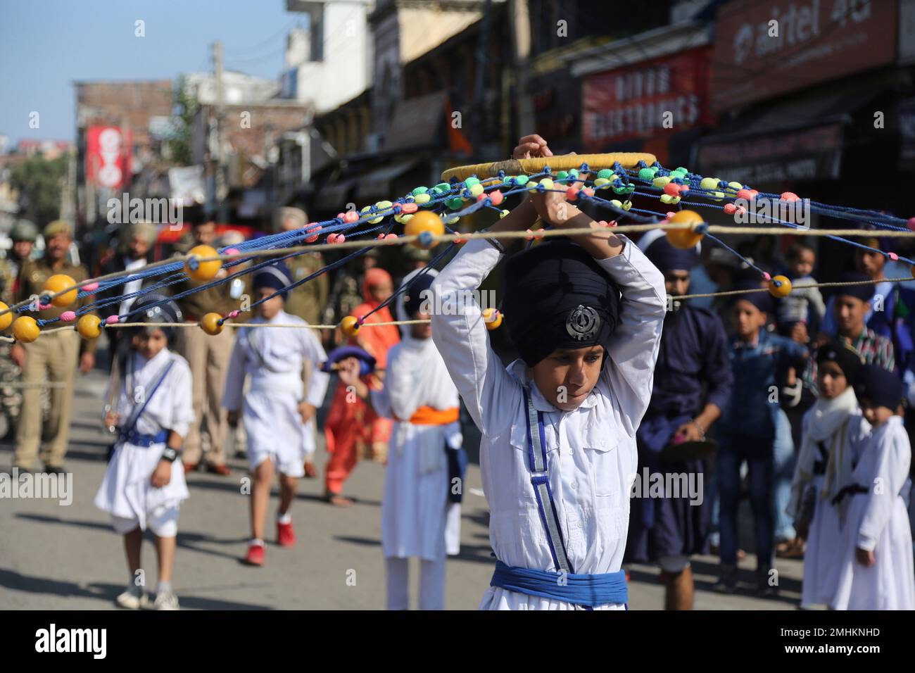 An Indian Sikh boy displays traditional martial arts skills during a ...
