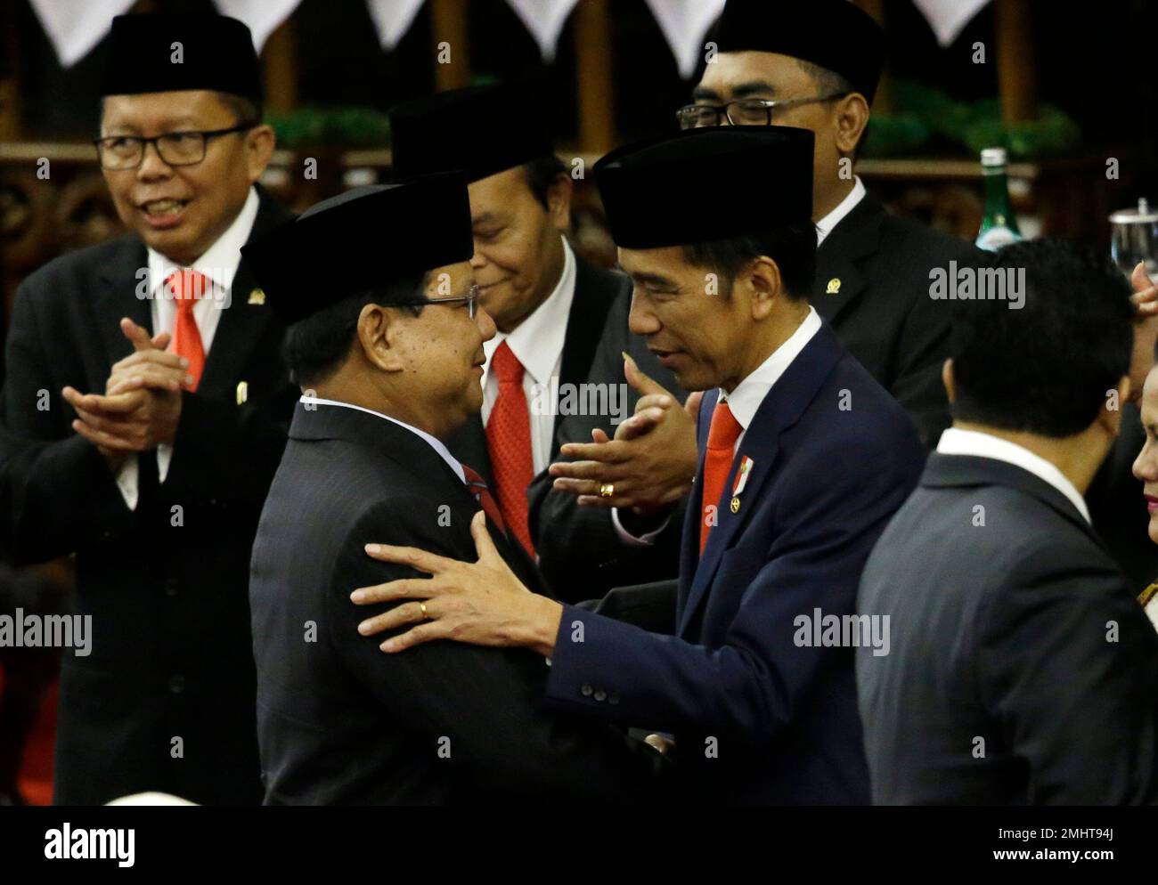 Indonesian President Joko Widodo, right, is congratulated by the ...