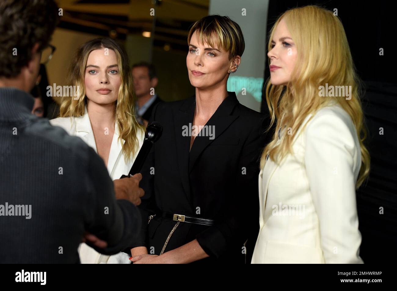 From left, cast members Margot Robbie, who plays Kayla Pospisil ...