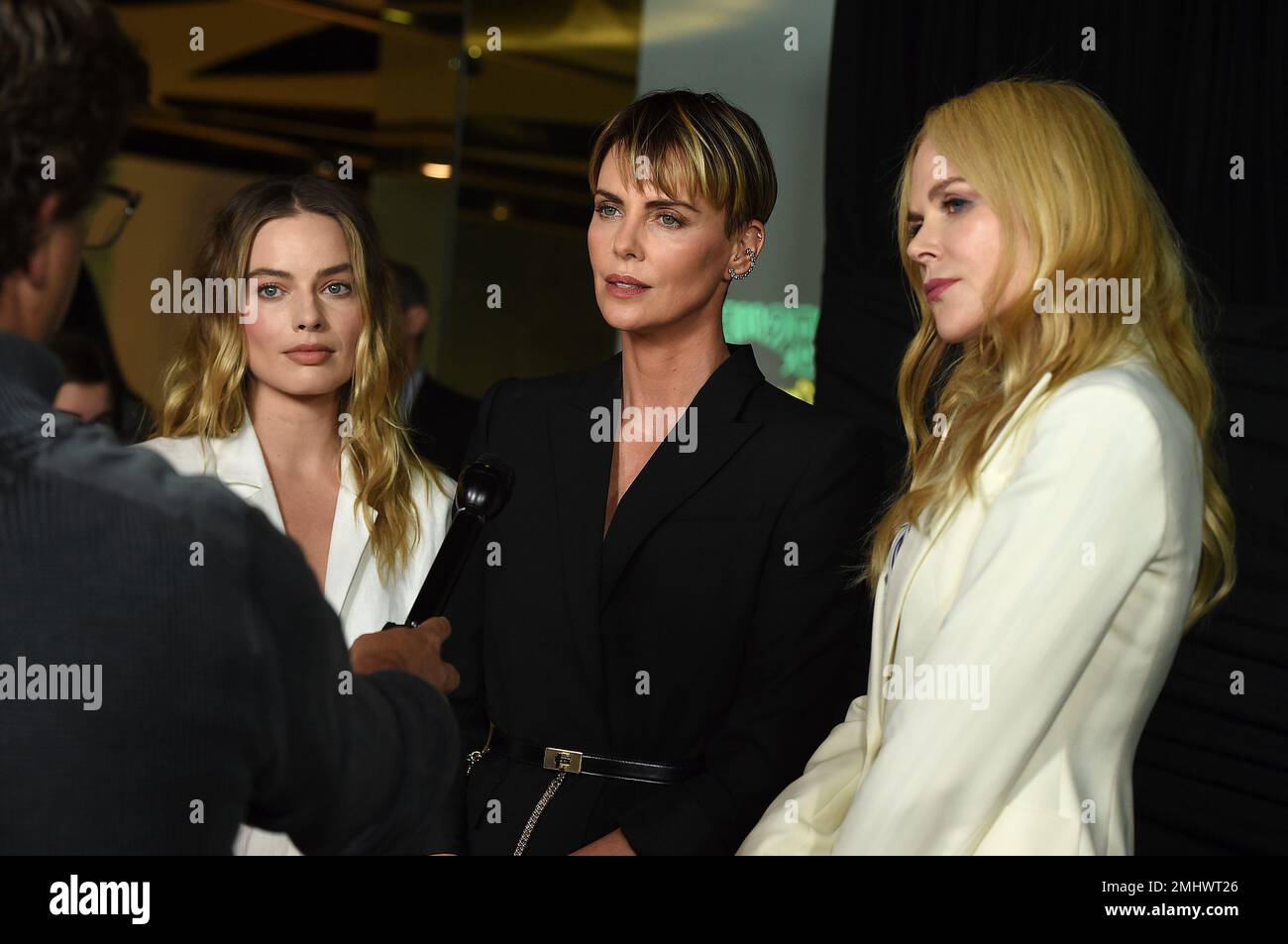 From left, cast members Margot Robbie, who plays Kayla Pospisil ...