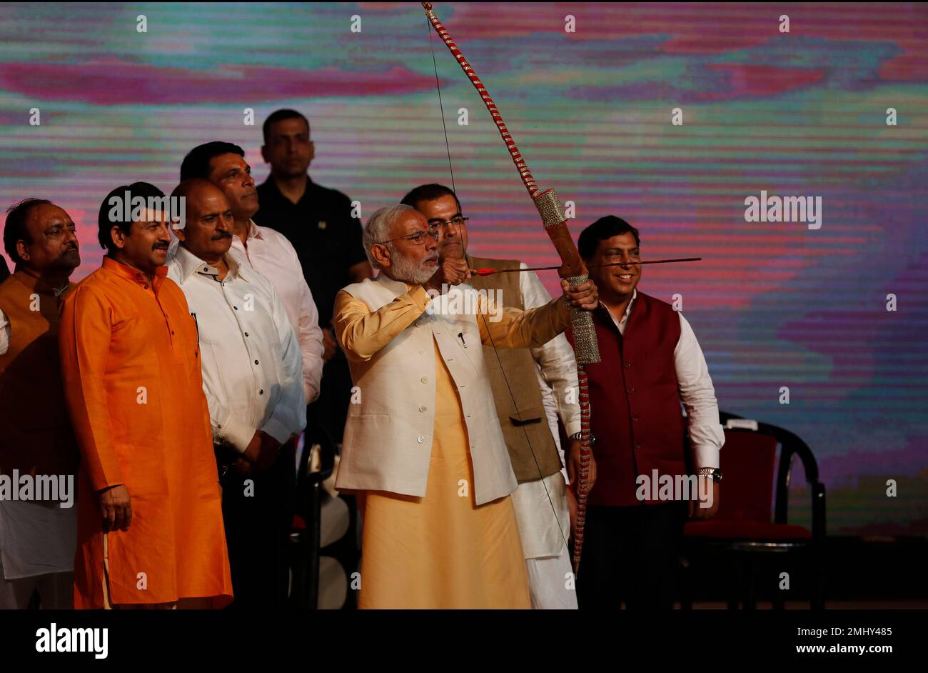 Indian Prime Minister Narendra Modi aims an arrow at an effigy of ...