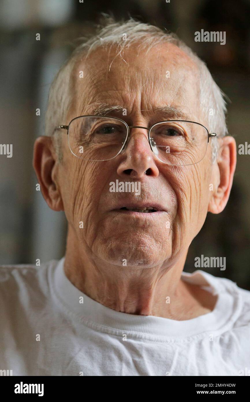 James Peebles pauses while talking to a reporter at his home in ...