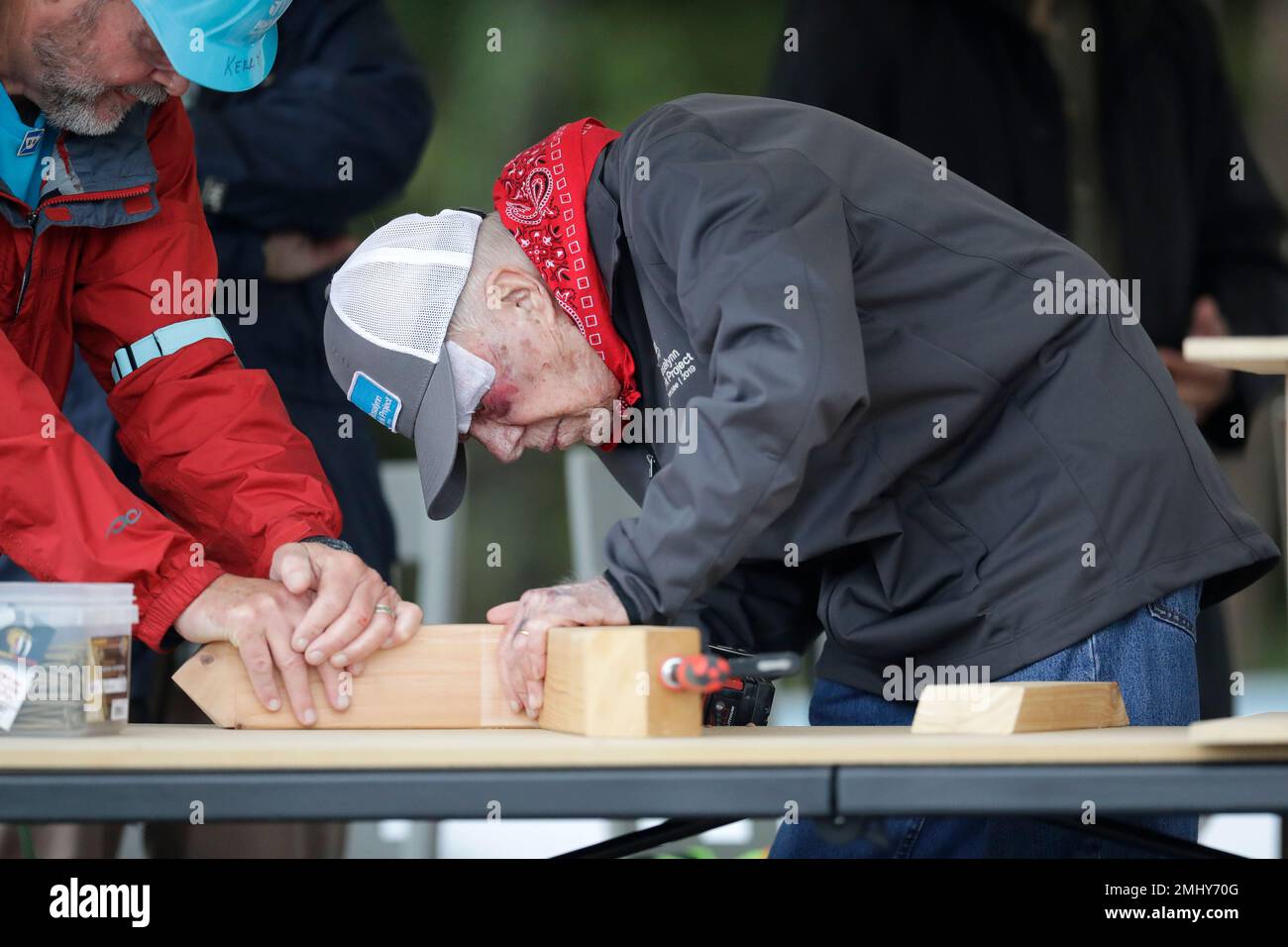 Former President Jimmy Carter works at a Habitat for Humanity building ...
