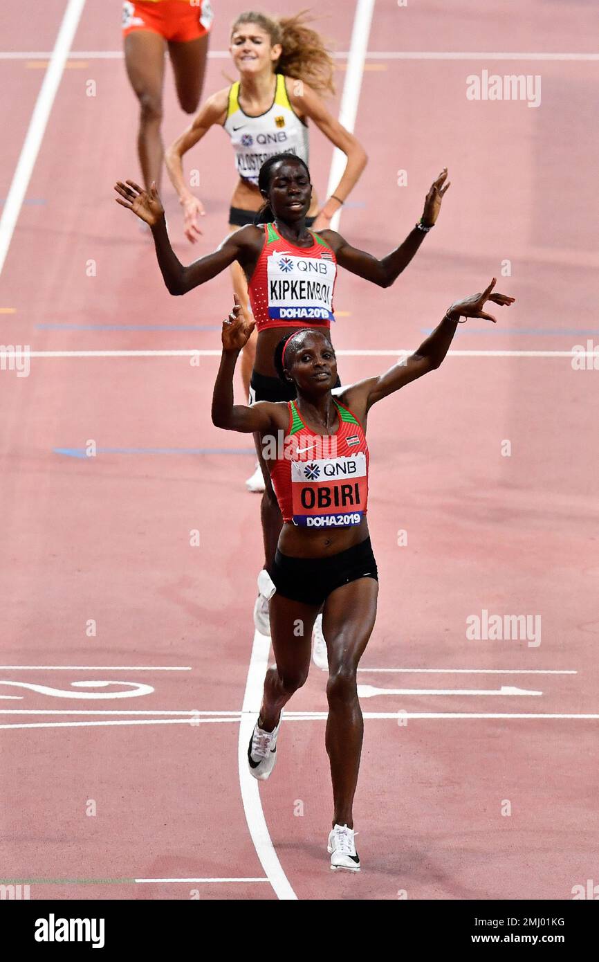 Hellen Obiri, of Kenya crosses the finish line to win the women's 5000 ...