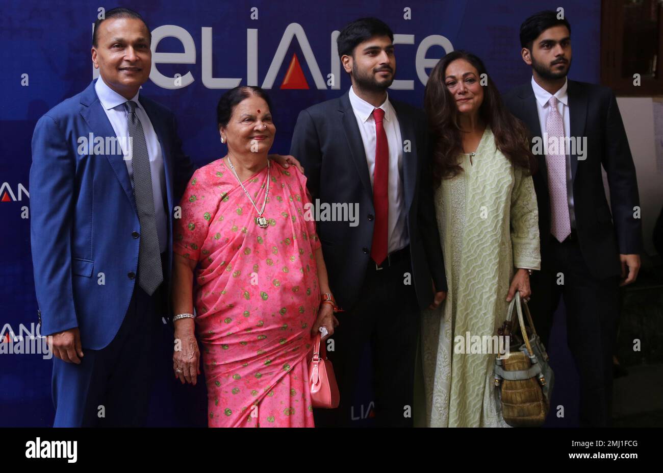 Anil Ambani, left, Chairman of Reliance Group poses for a picture with ...
