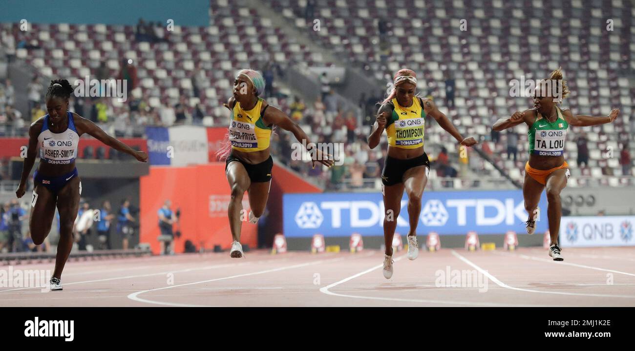 Shelly-Ann Fraser-Pryce, of Jamaica, second left, wins the gold medal in the women's 100 meter ...