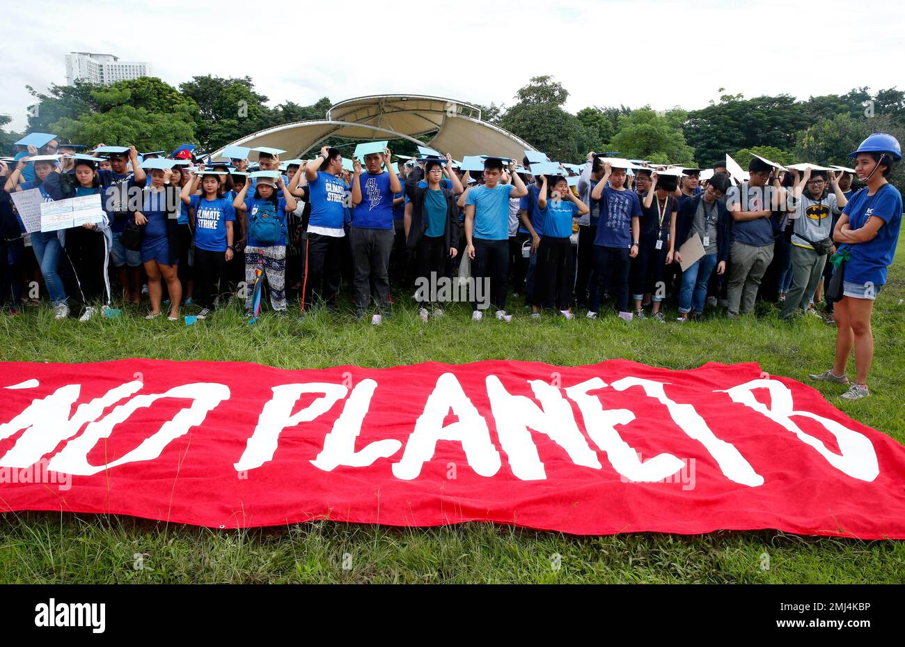 Environmental activists, mostly students, display their message in ...