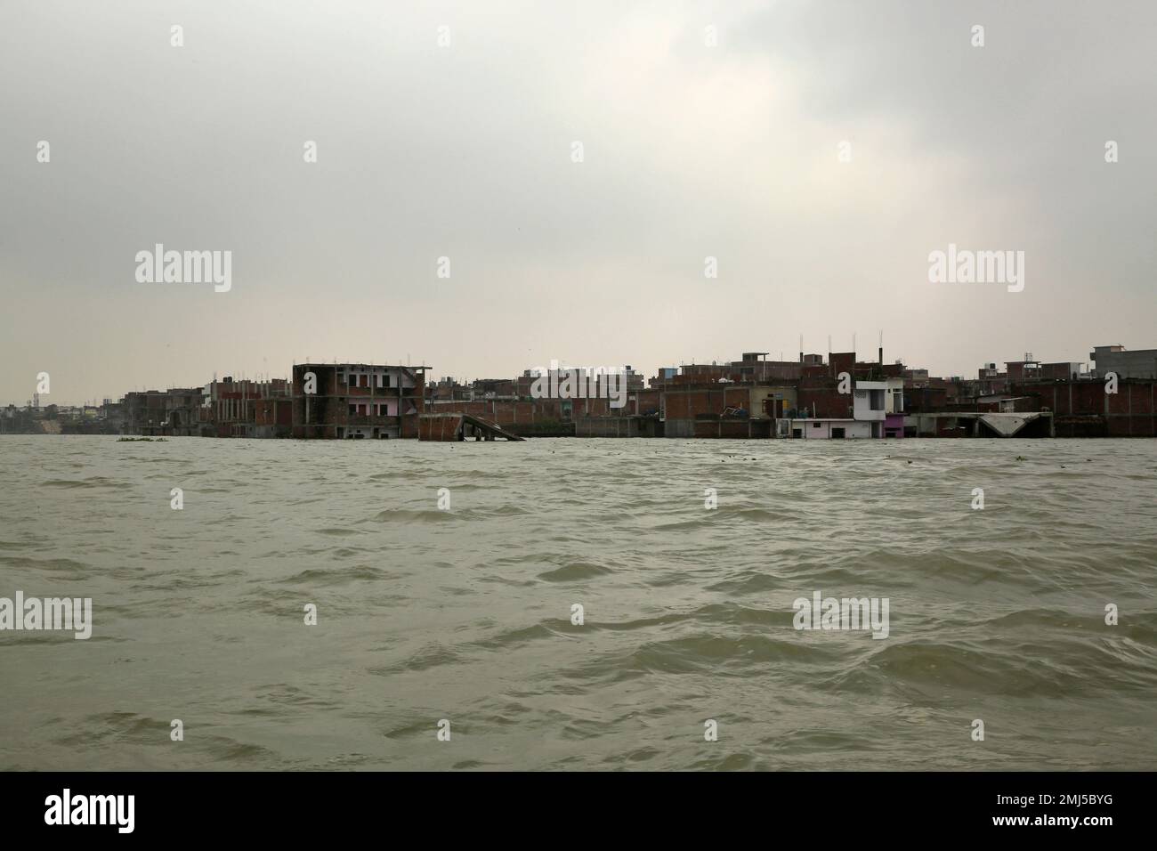 Houses are seen submerged by the River Ganges in Prayagraj, India ...