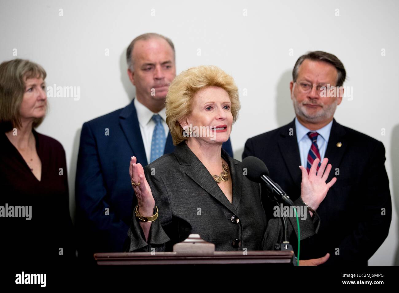 Sen. Debbie Stabenow, D-Mich., center, accompanied by Rep. Dan Kildee ...