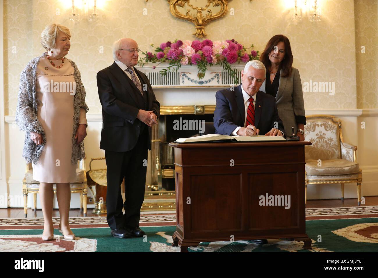 Irish President Michael D Higgins and his wife Sabrina, left, look on ...