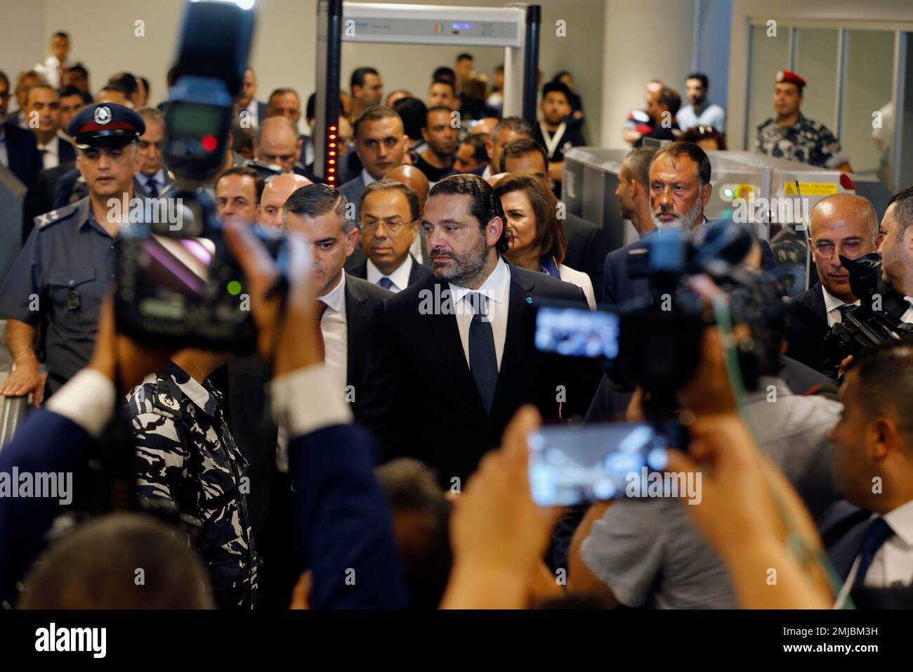 Lebanese Prime Minister Saad Hariri, center, looks at new scanners at ...