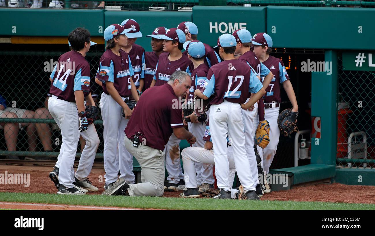 Barrington, Rhode Island coach Frank Fede, center talks with his ...