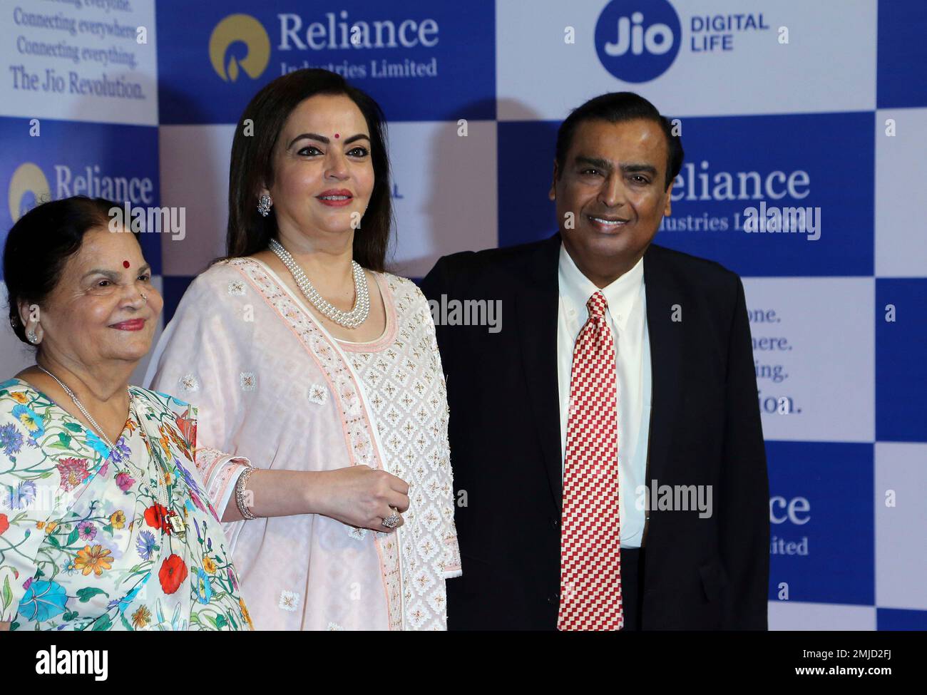 Chairman of Reliance Industries Limited Mukesh Ambani, right, with wife Neeta Ambani and mother ...