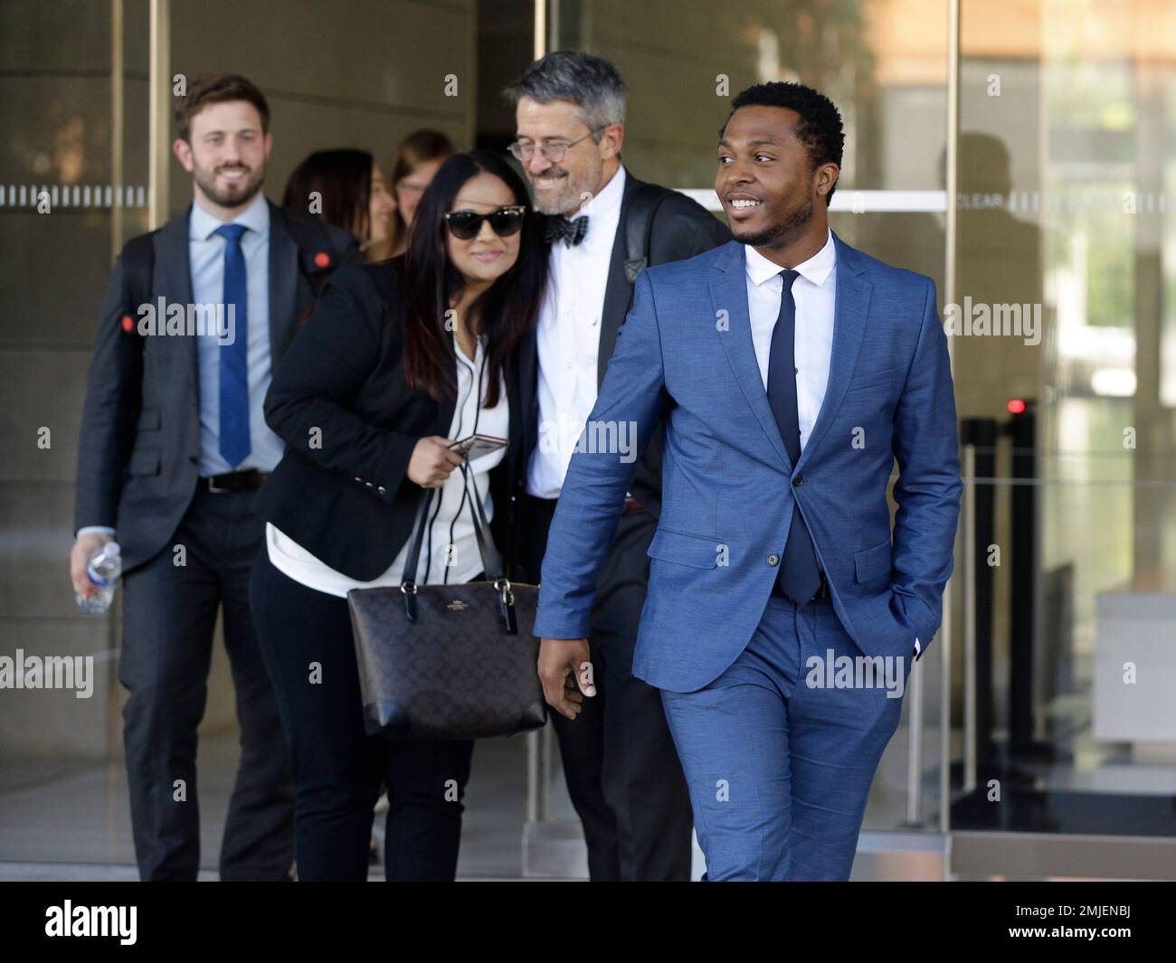 Rapper Marcus Gray, right, with his attorney, Michael A. Kahn, second ...