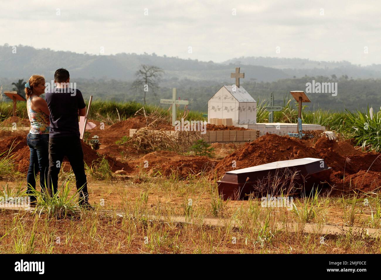 Family members attend the funeral of a prisoner who was killed during a ...