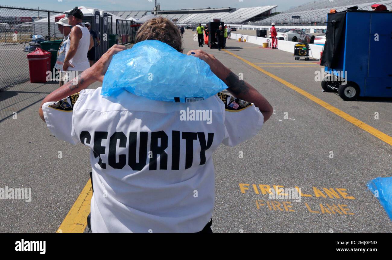 Track security officer Patty Patterson carries a bag of ice on her ...