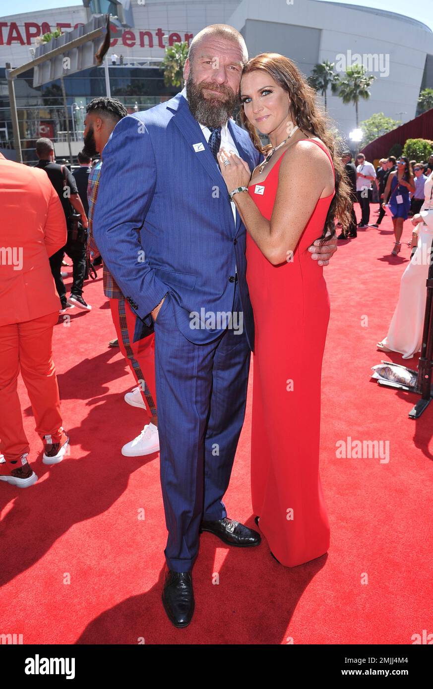 Triple H, left, and Stephanie McMahon, chief brand officer of WWE ...