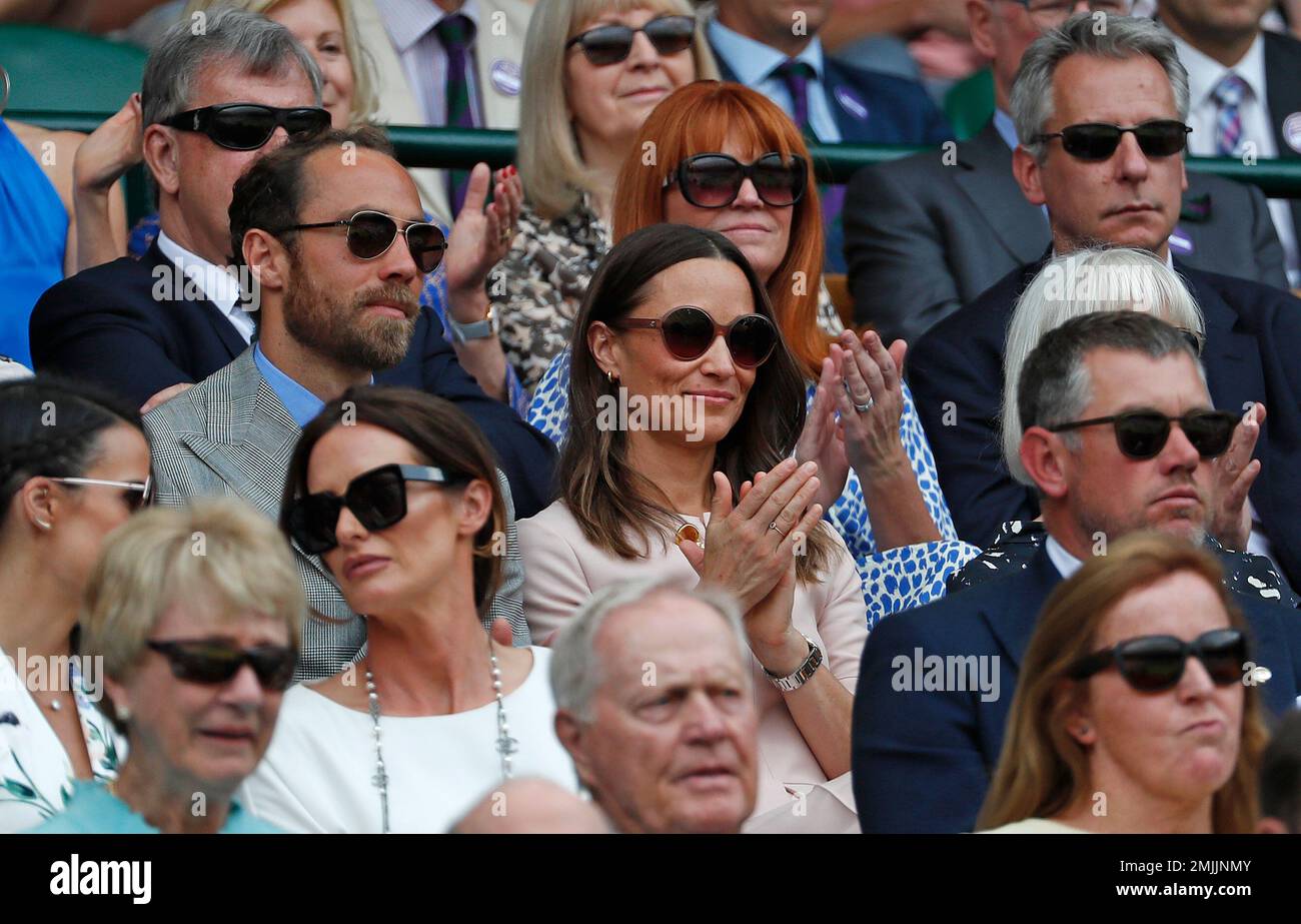 Pippa Middleton, center, and her brother James, top left, sit in the ...