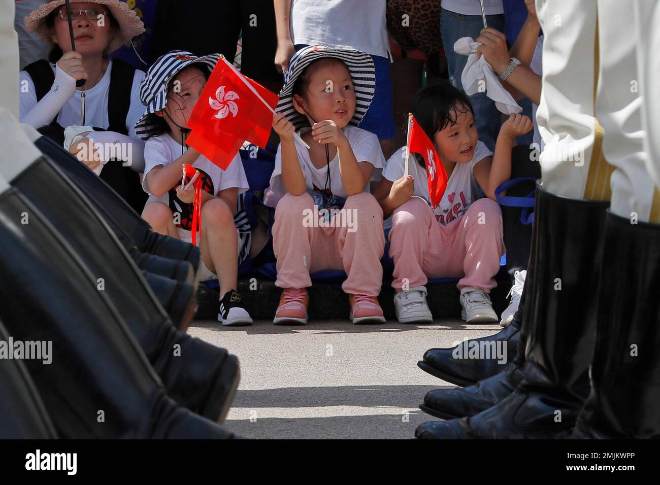 Children watch the Chinese People's Liberation Army (PLA) soldiers ...