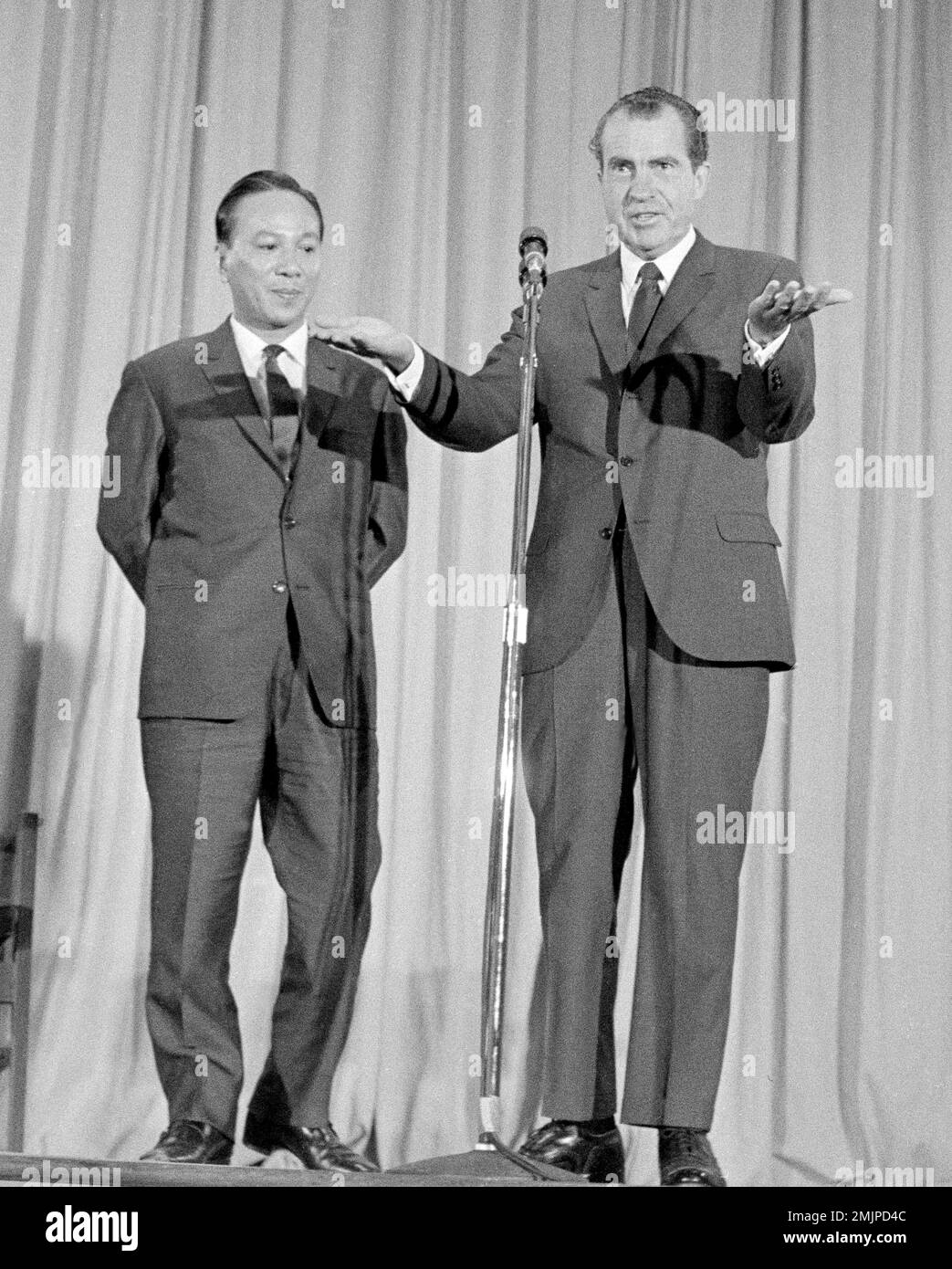 President Richard Nixon gestures to his audience, composed mostly of ...